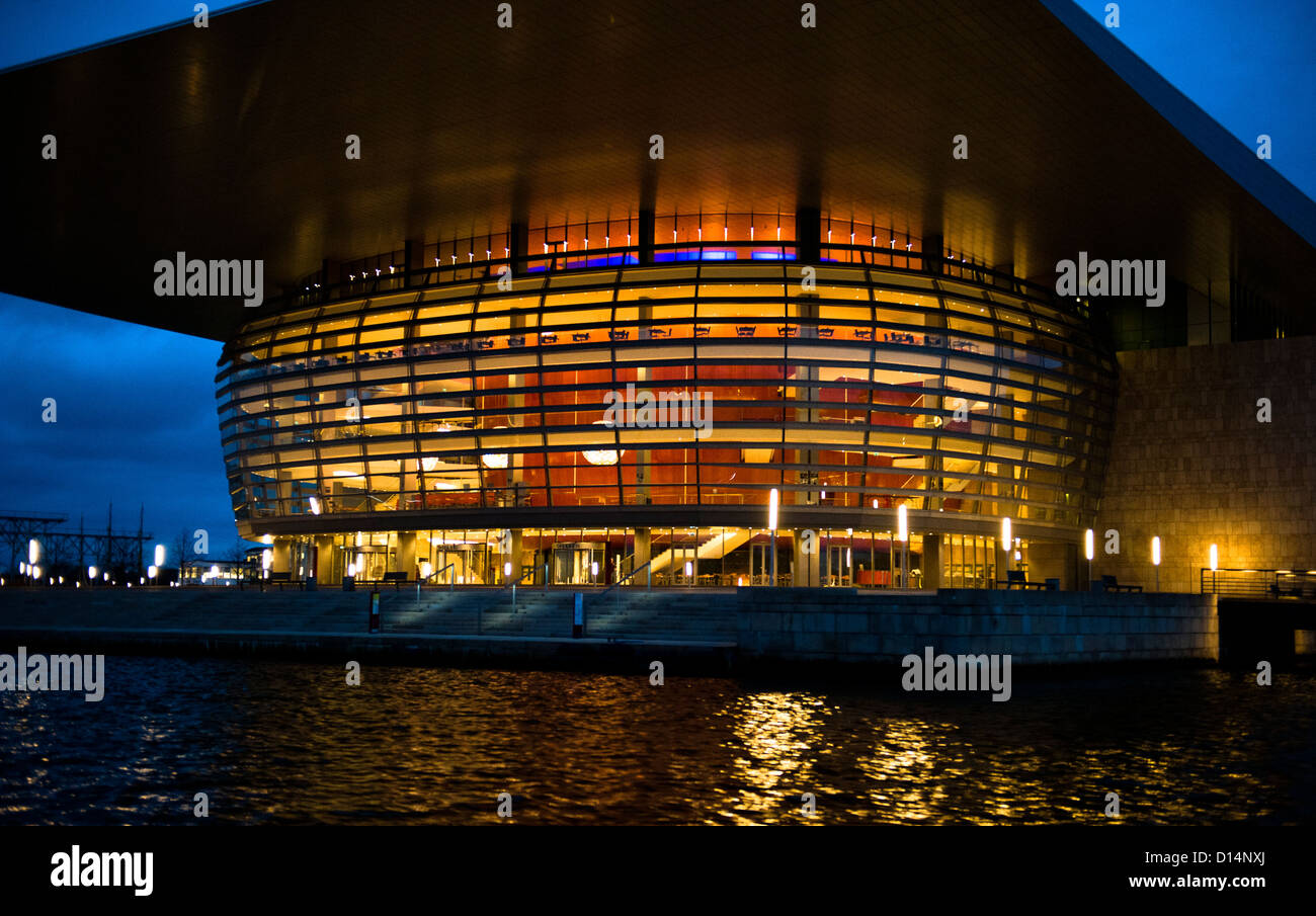 Copenhagen's opera house on the harbour waterfront at dusk in winter ...