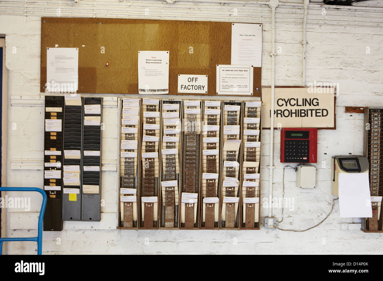 Time cards and clock in factory Stock Photo - Alamy