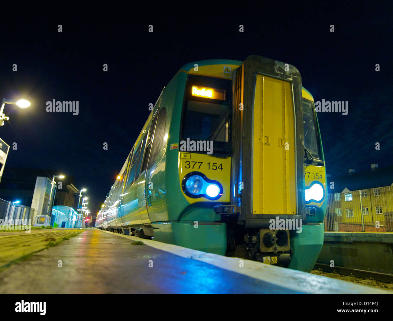 "Electrostar" under a starlit and moonlit night sky, an empty railway ...
