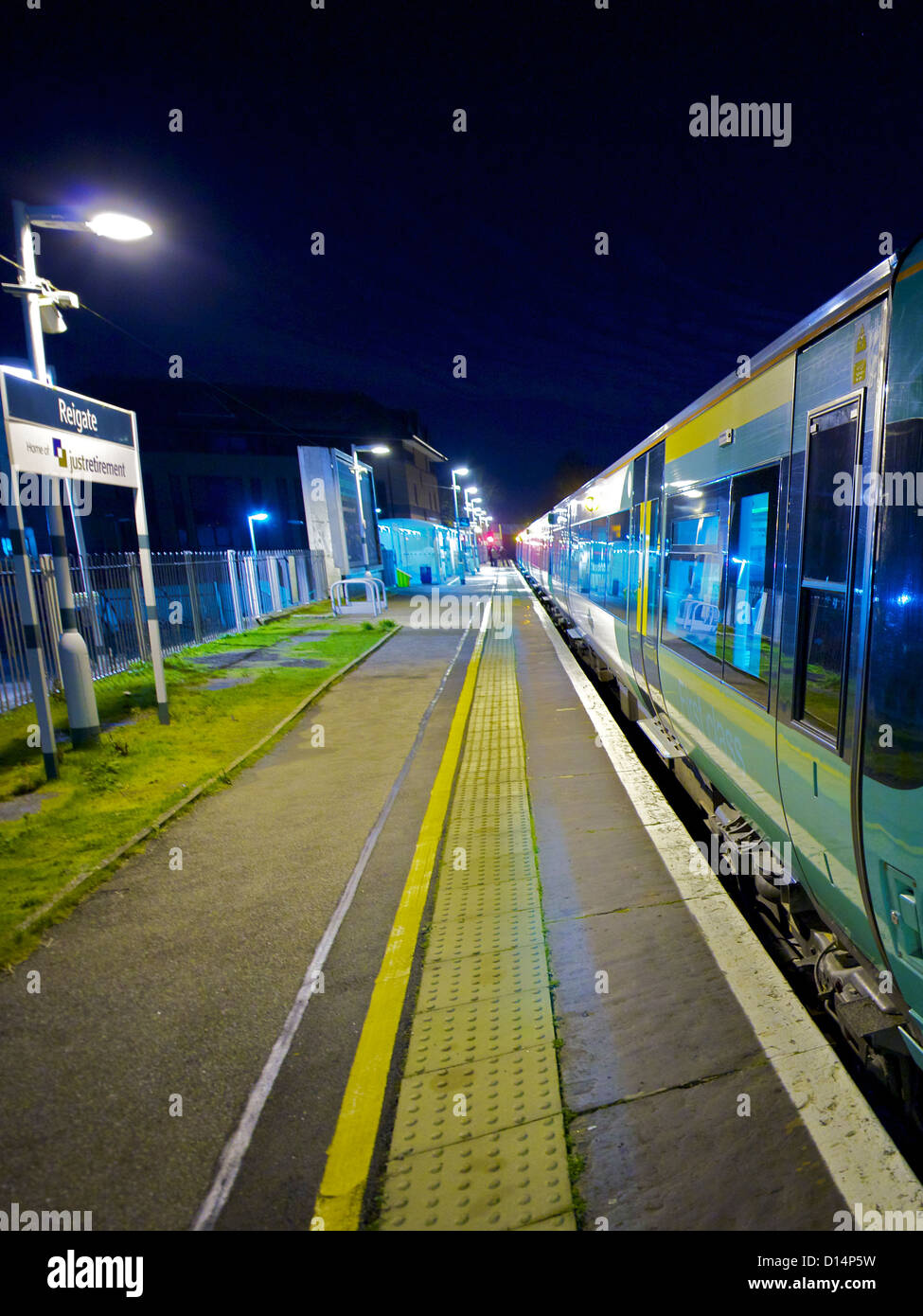 "Electrostar" under a starlit and moonlit night sky, an empty railway ...