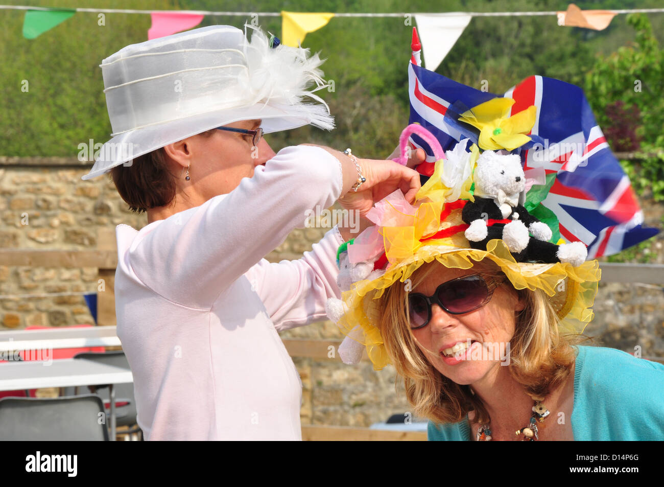 Preparing for the best hat competition UK Stock Photo - Alamy