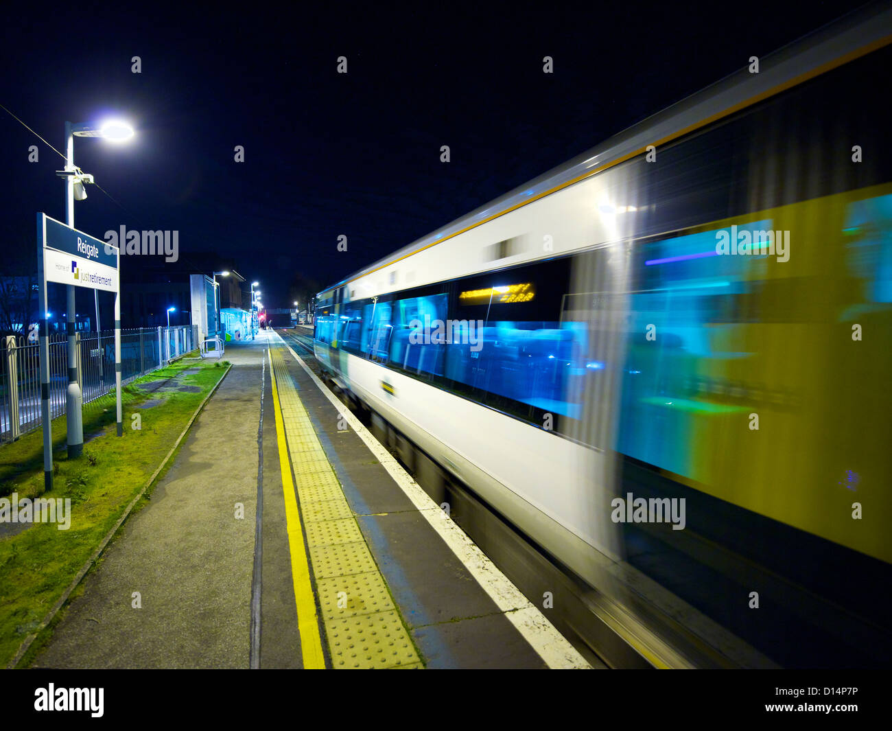 "Electrostar" under a starlit and moonlit night sky, an empty railway ...