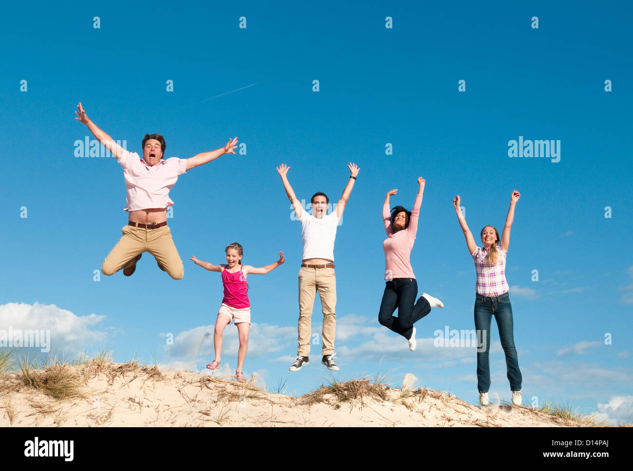Mother father children cheering hi-res stock photography and images - Alamy