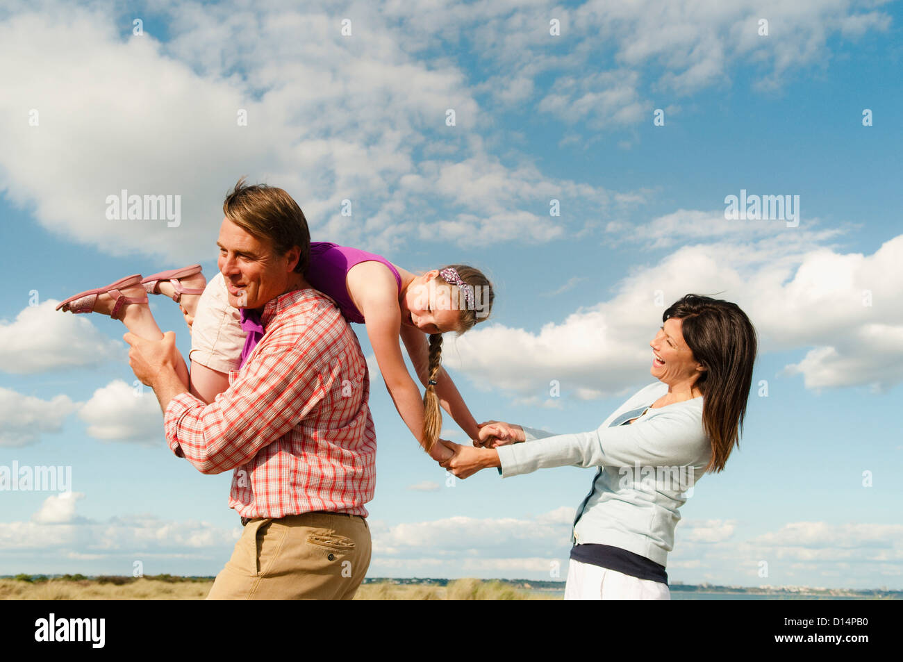 Family playing together outdoors Stock Photo - Alamy