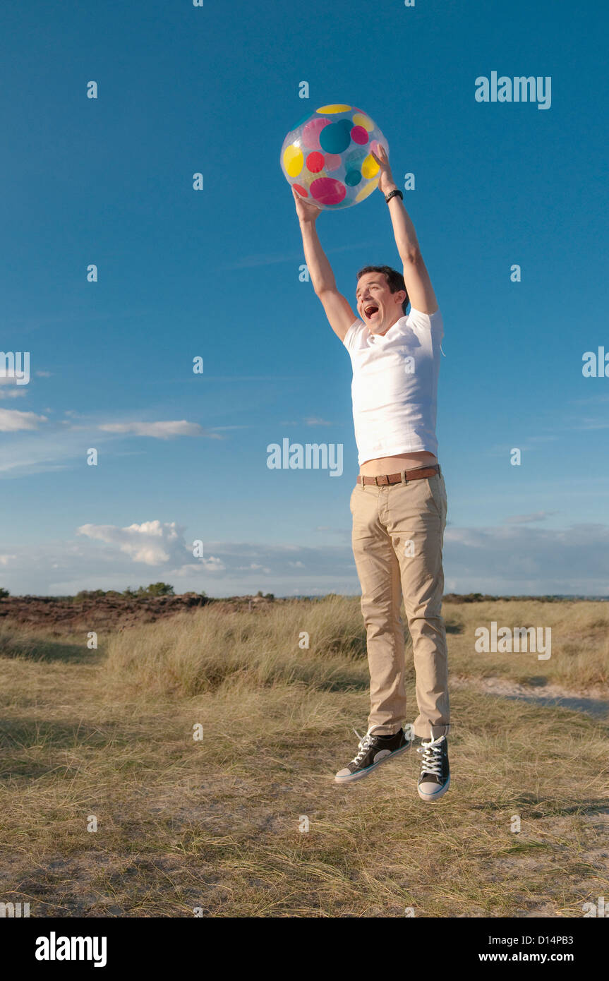 Man jumping for joy outdoors Stock Photo - Alamy