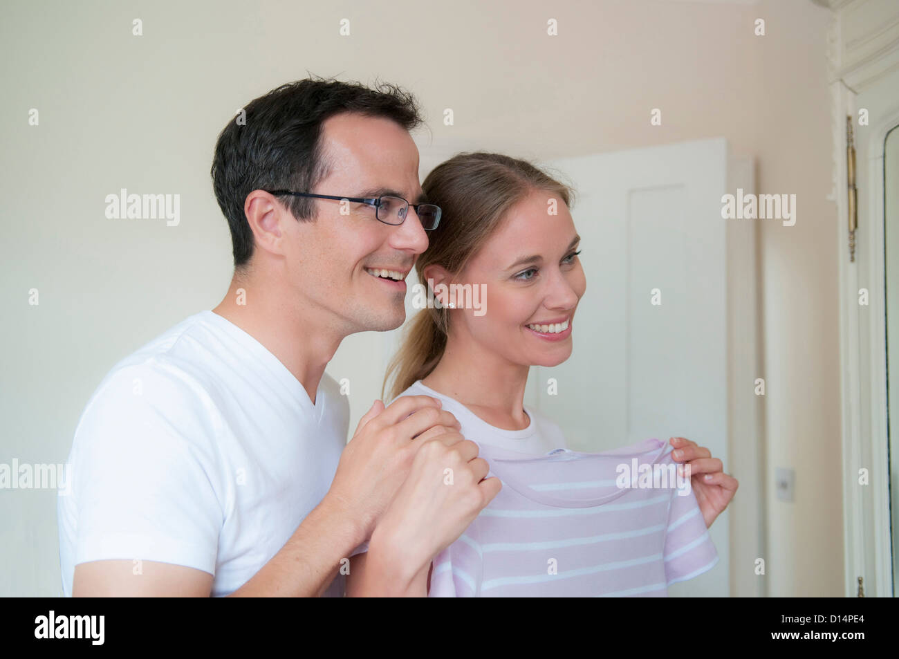 Woman getting dressed jumper hi-res stock photography and images - Alamy