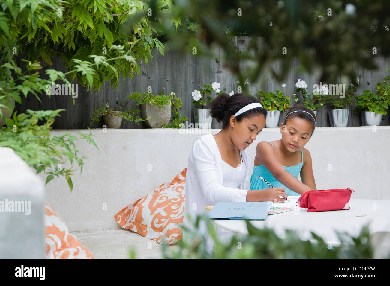 Students working together outdoors Stock Photo - Alamy