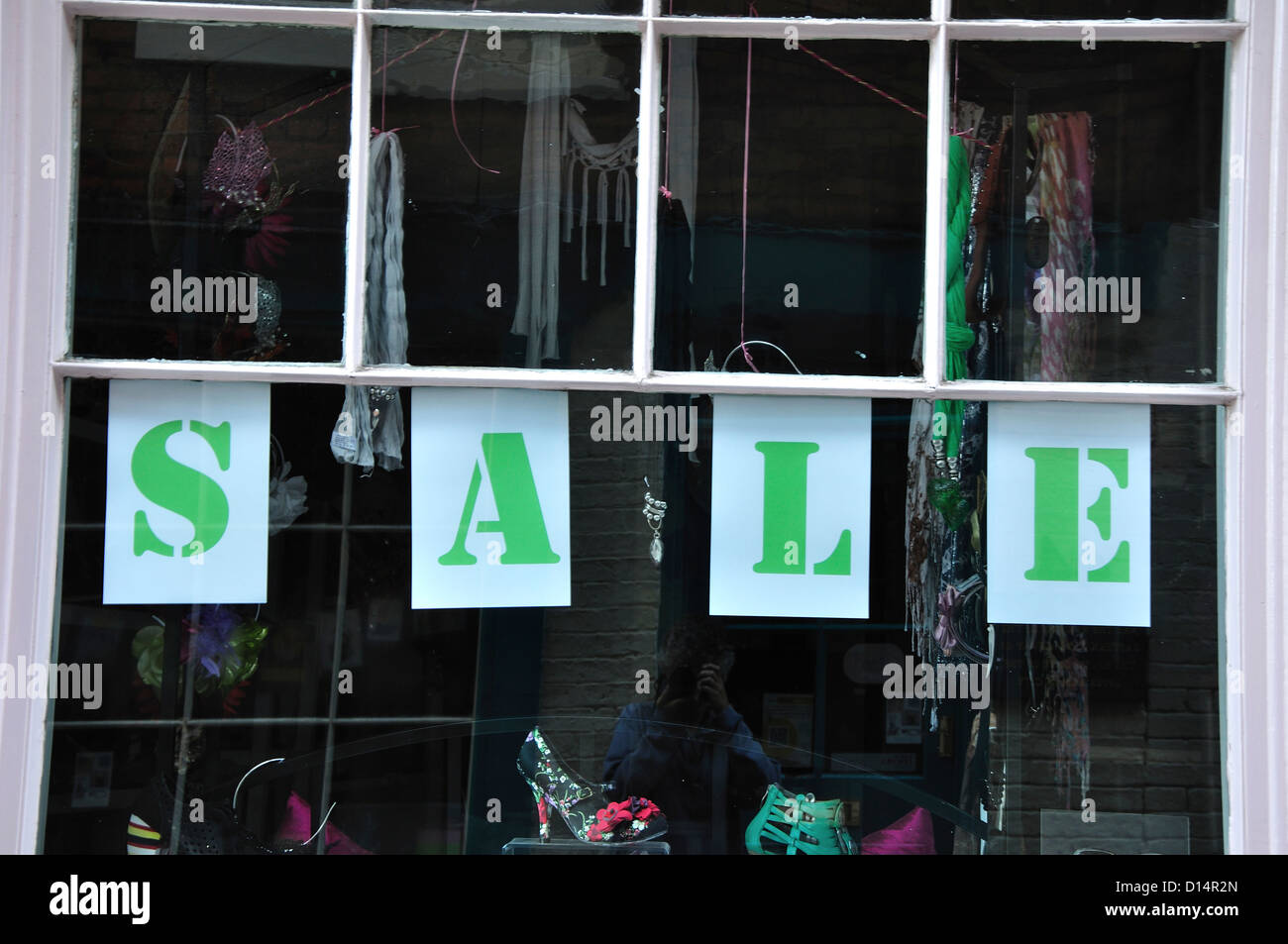 A shop window with a sale sign UK Stock Photo - Alamy