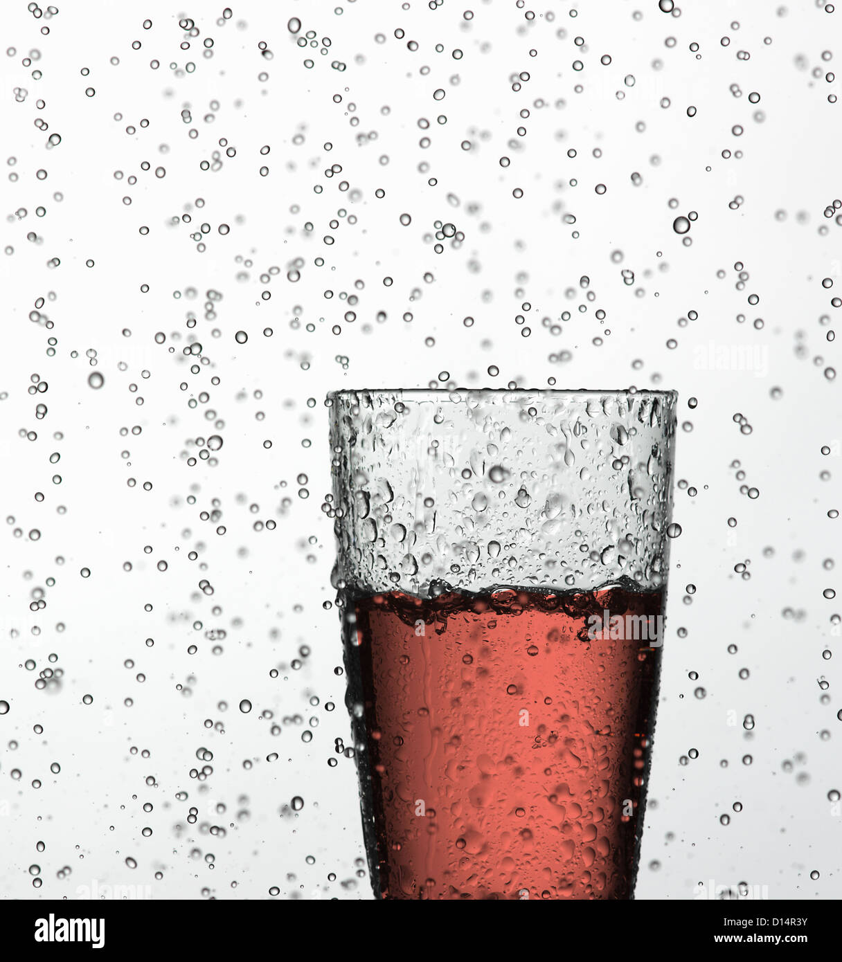 Glass of juice in water drops Stock Photo - Alamy