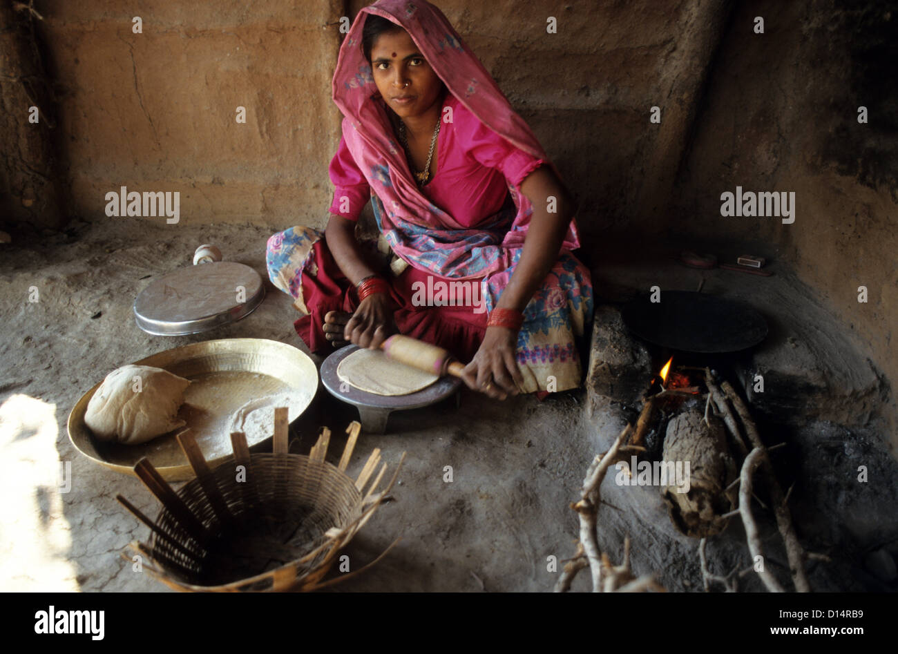 India Madhya Pradesh Kasrawad, woman prepare indian bread chapathi in ...
