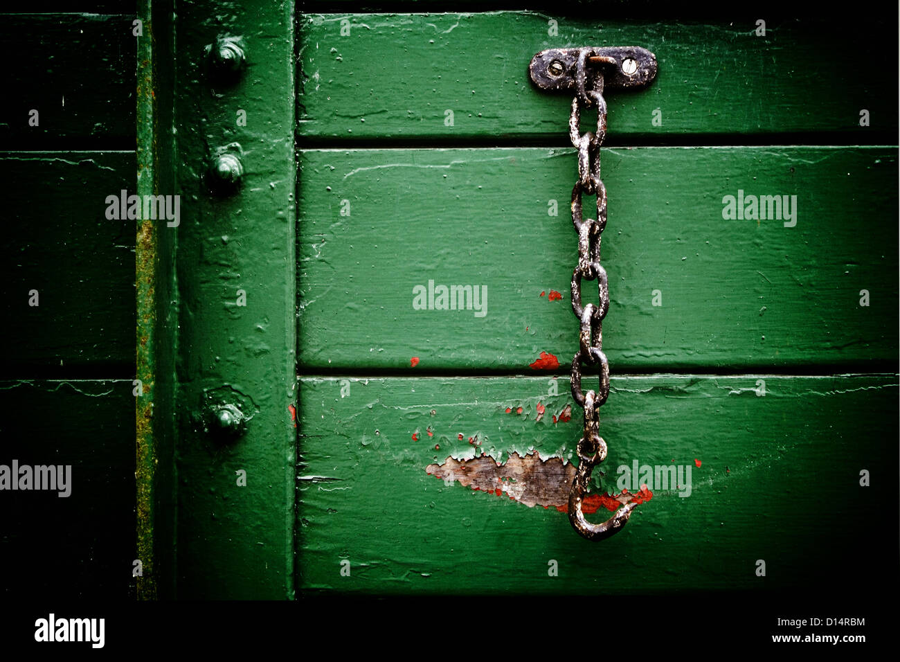 Metal chain hanging on old wooden train carriage door Stock Photo - Alamy