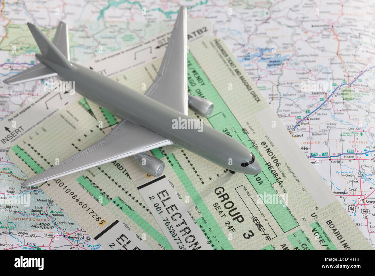 Model airplane and airplane tickets on map Stock Photo - Alamy