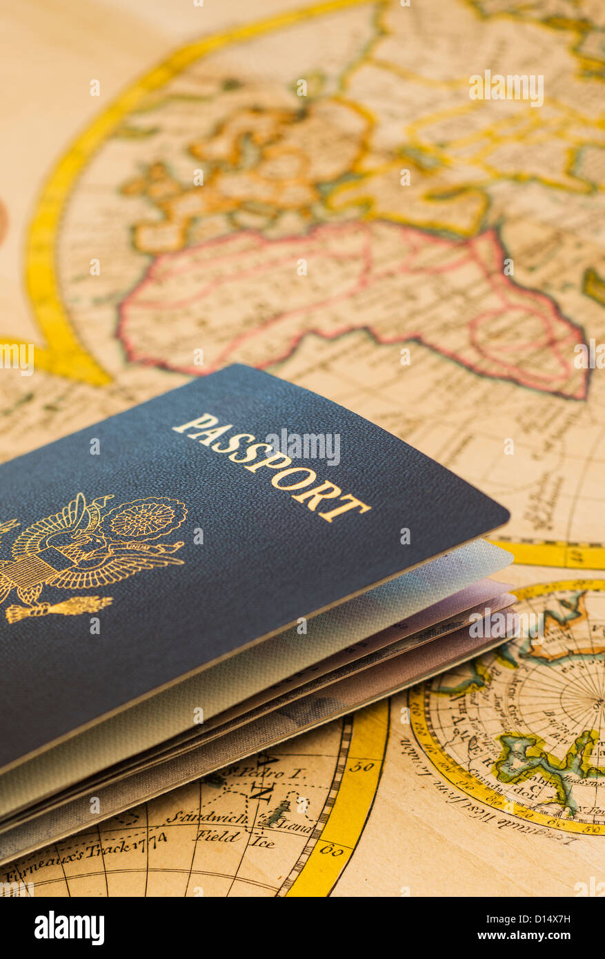 Passport sitting on antique map Stock Photo - Alamy
