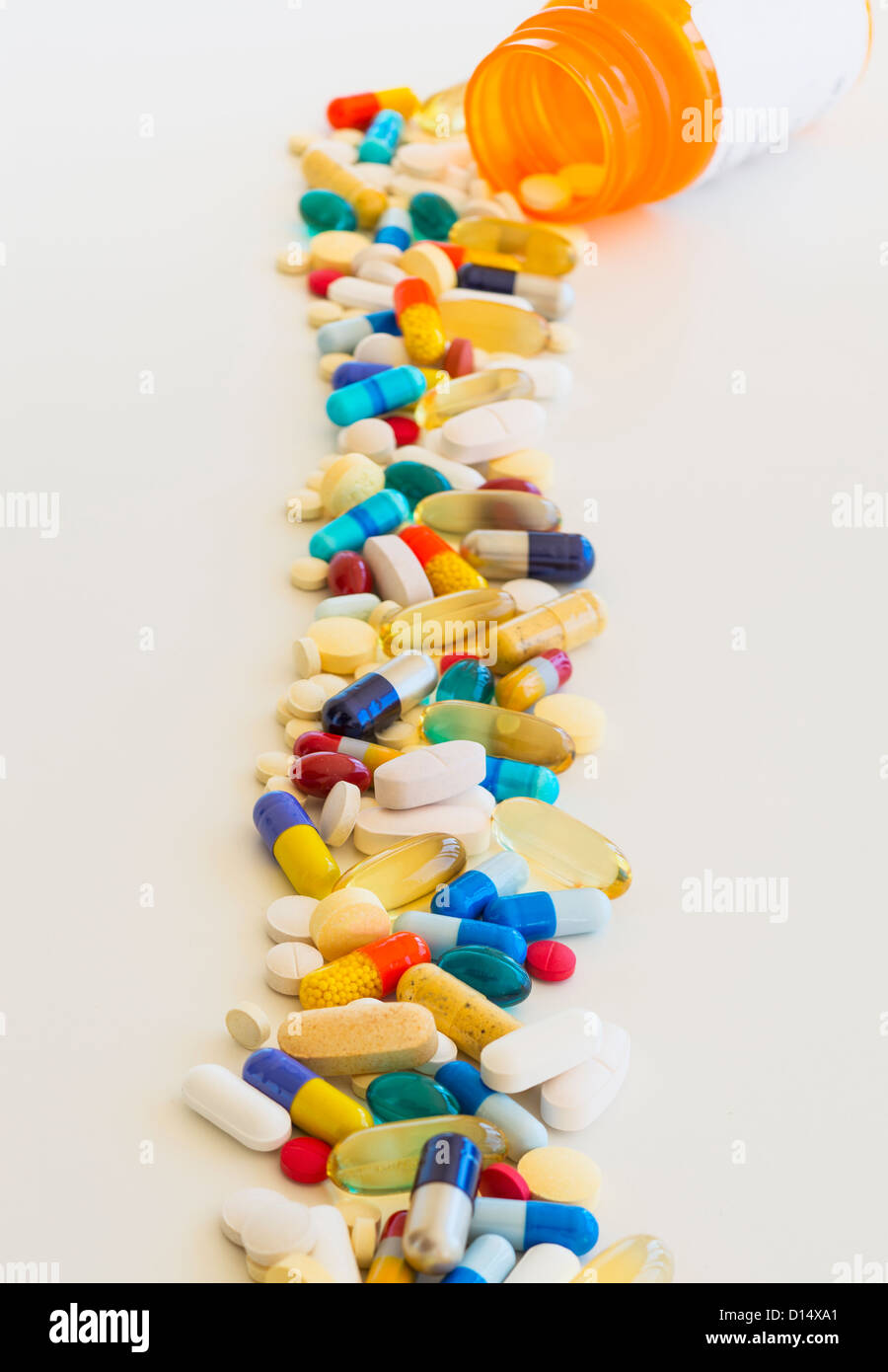 Colorful pills on white background Stock Photo - Alamy