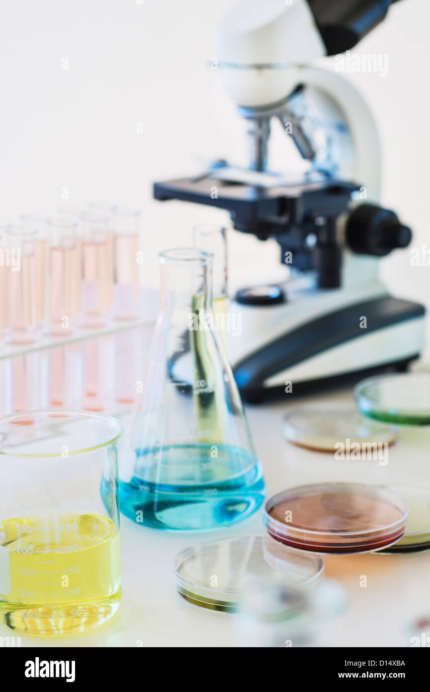 Beakers and microscope Stock Photo - Alamy