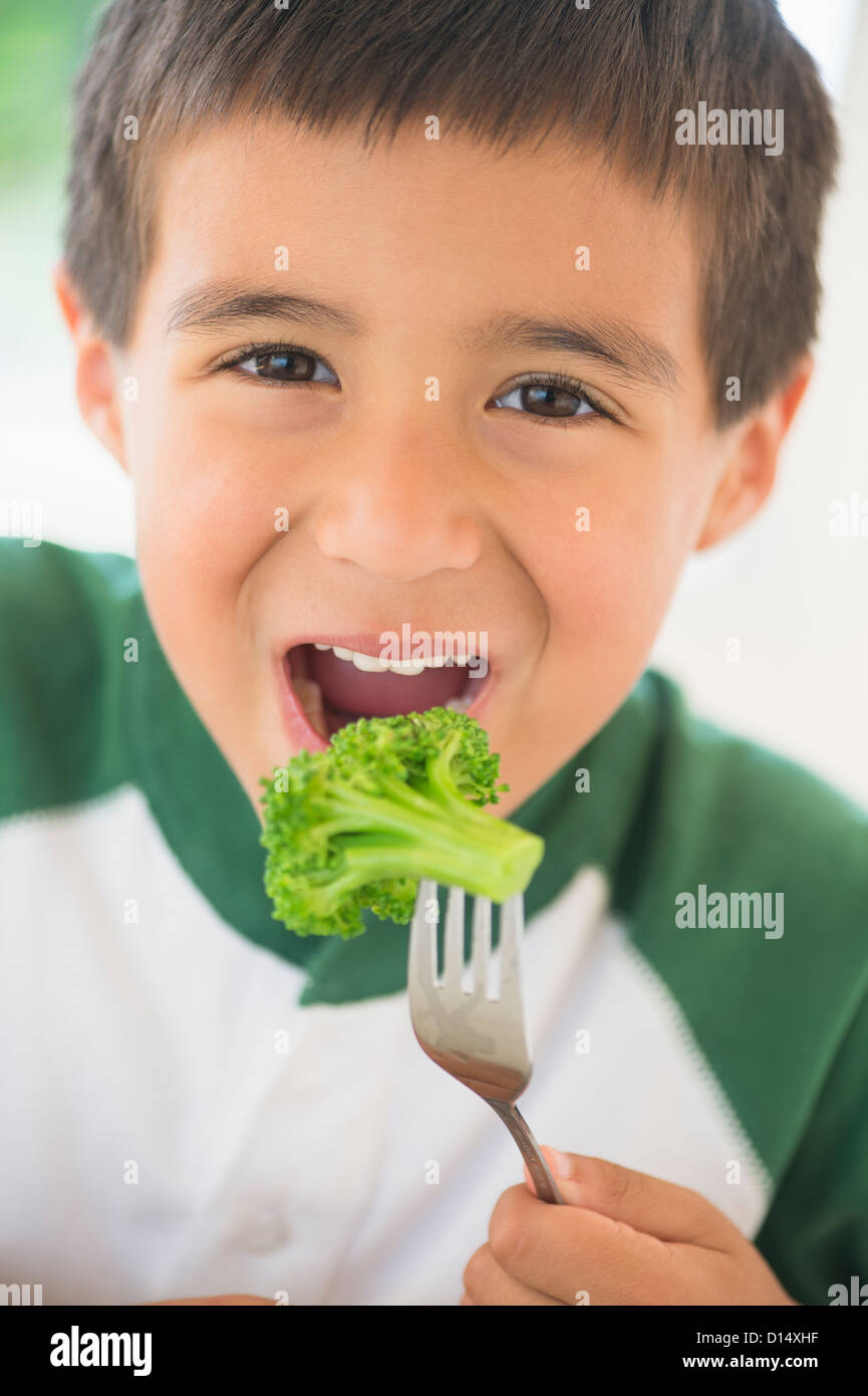Boy eating broccoli fork hi-res stock photography and images - Alamy