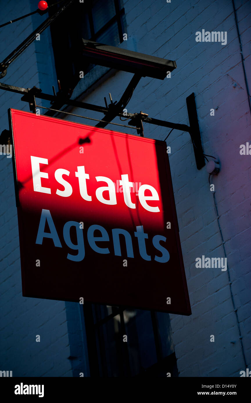 Sunlight illuminating an estate agent sign Stock Photo - Alamy