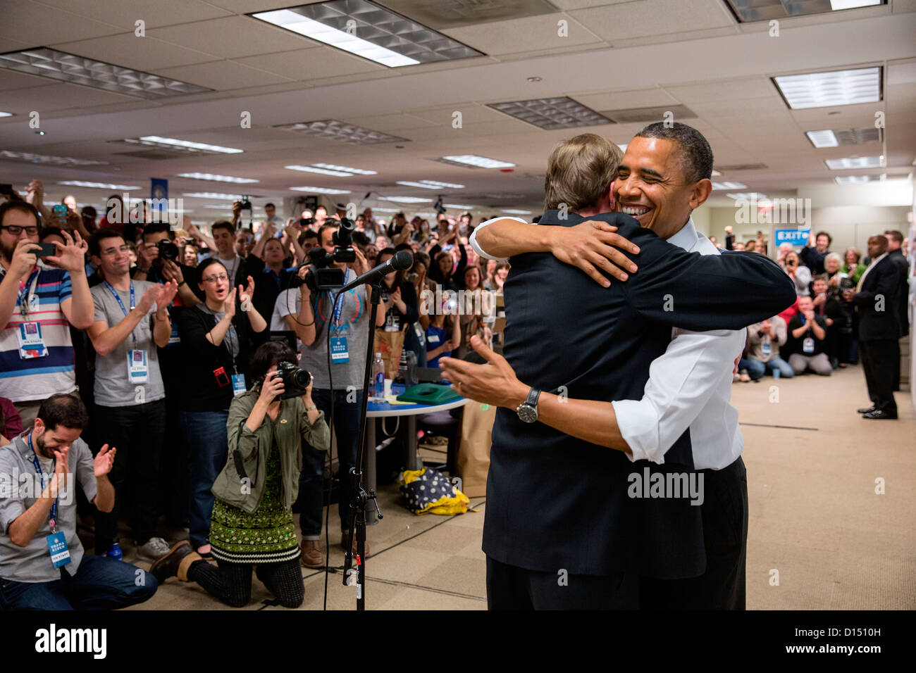 US President Barack Obama hugs his campaign manager Jim Messina during ...