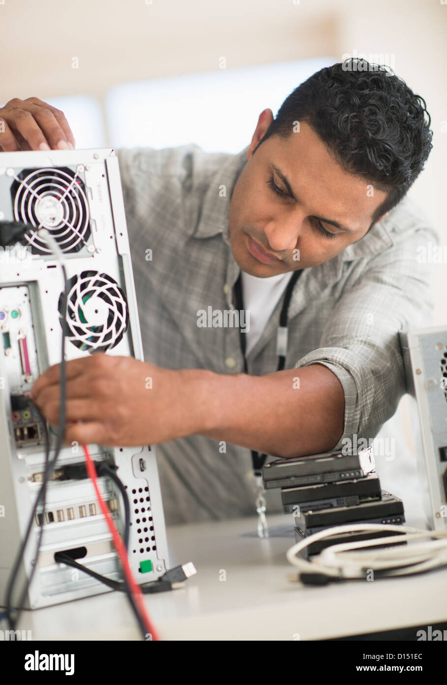 USA, New Jersey, Jersey City, Man repairing computer Stock Photo - Alamy