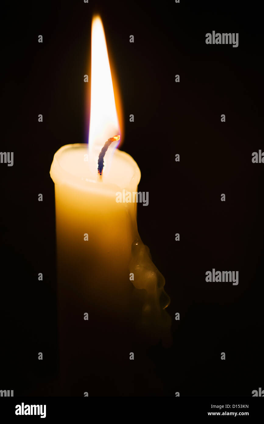 Studio shot of burning candle Stock Photo - Alamy