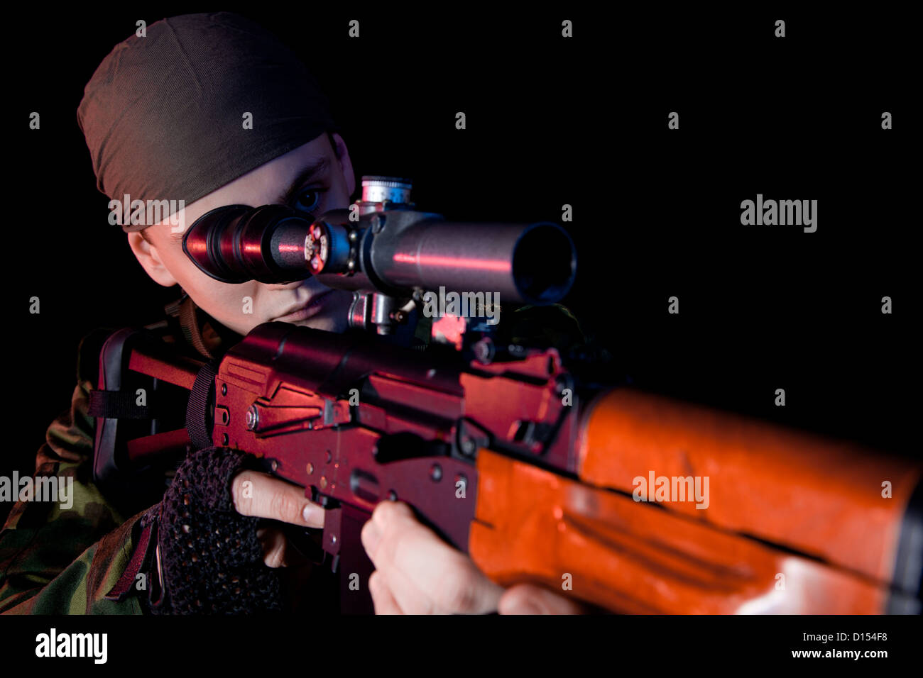 Soldier with rifle, selective focus on face Stock Photo - Alamy