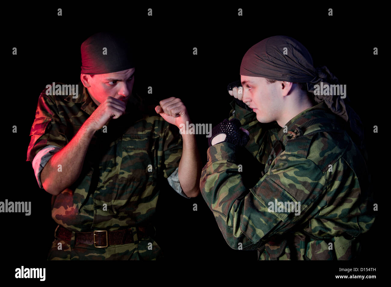 Two soldiers fighting, isolated on black background Stock Photo - Alamy