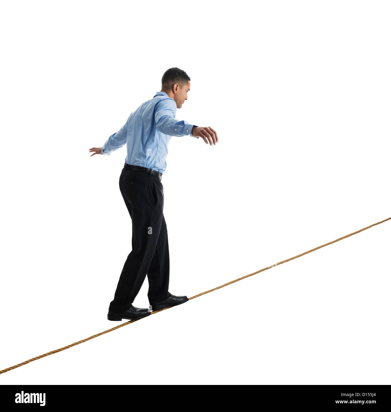 Man balancing on tightrope, studio shot Stock Photo - Alamy