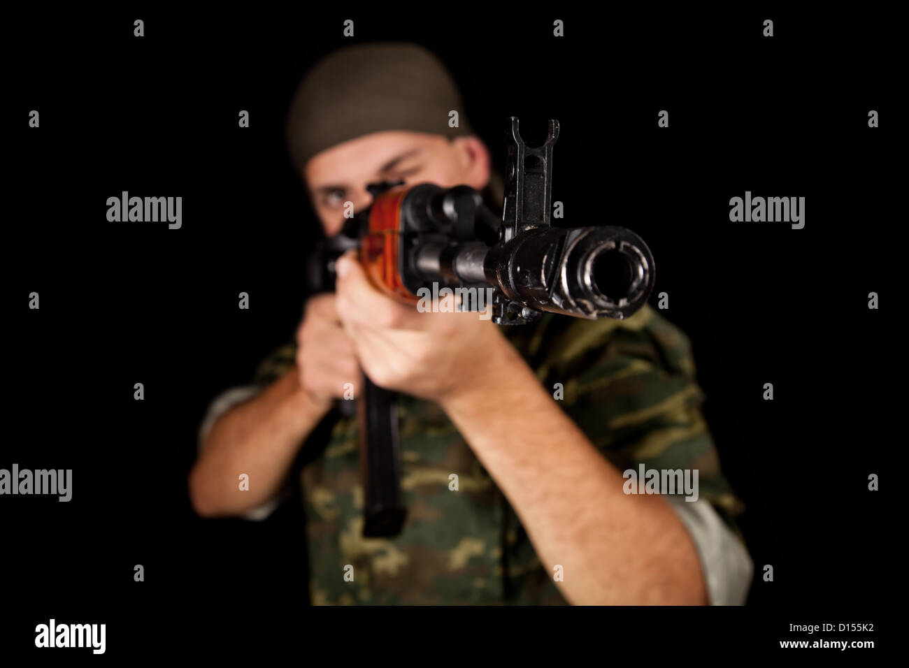 Young soldier in uniform with rifle, selective focus on weapon Stock ...