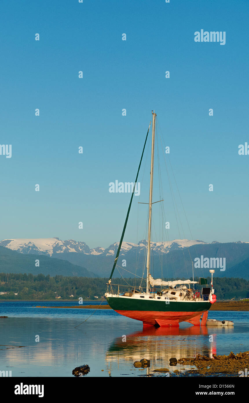 High and dry, sailboat anchored at low tide, Comox, Vancouver Island ...