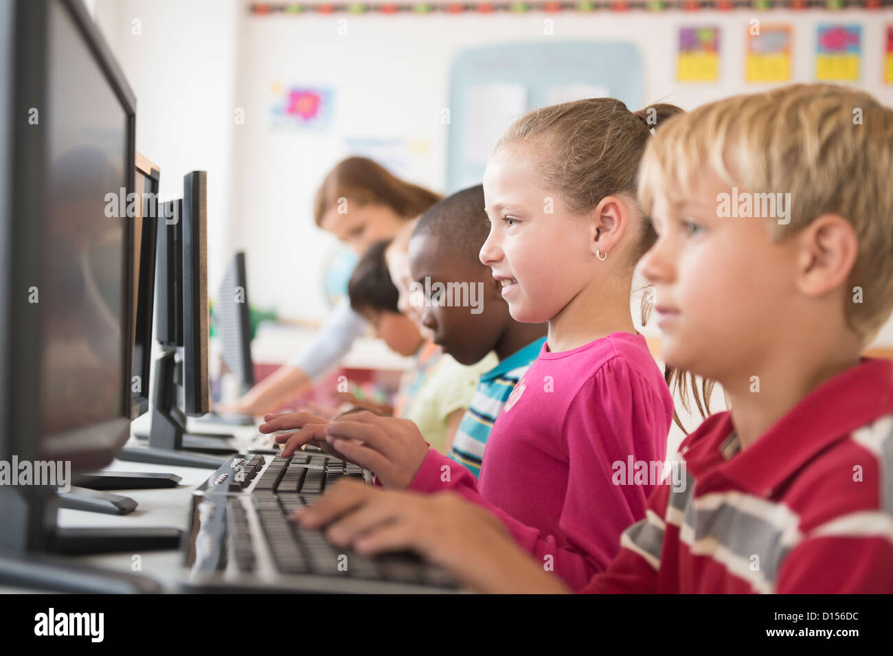 USA, New Jersey, Jersey City, School children (8-9) with female teacher ...