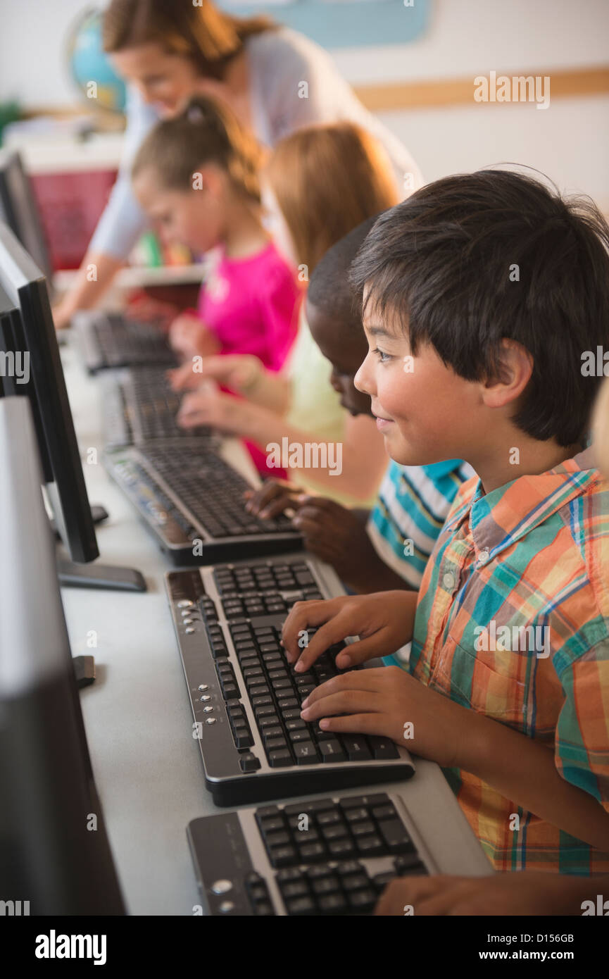 USA, New Jersey, Jersey City, School children (8-9) with female teacher ...
