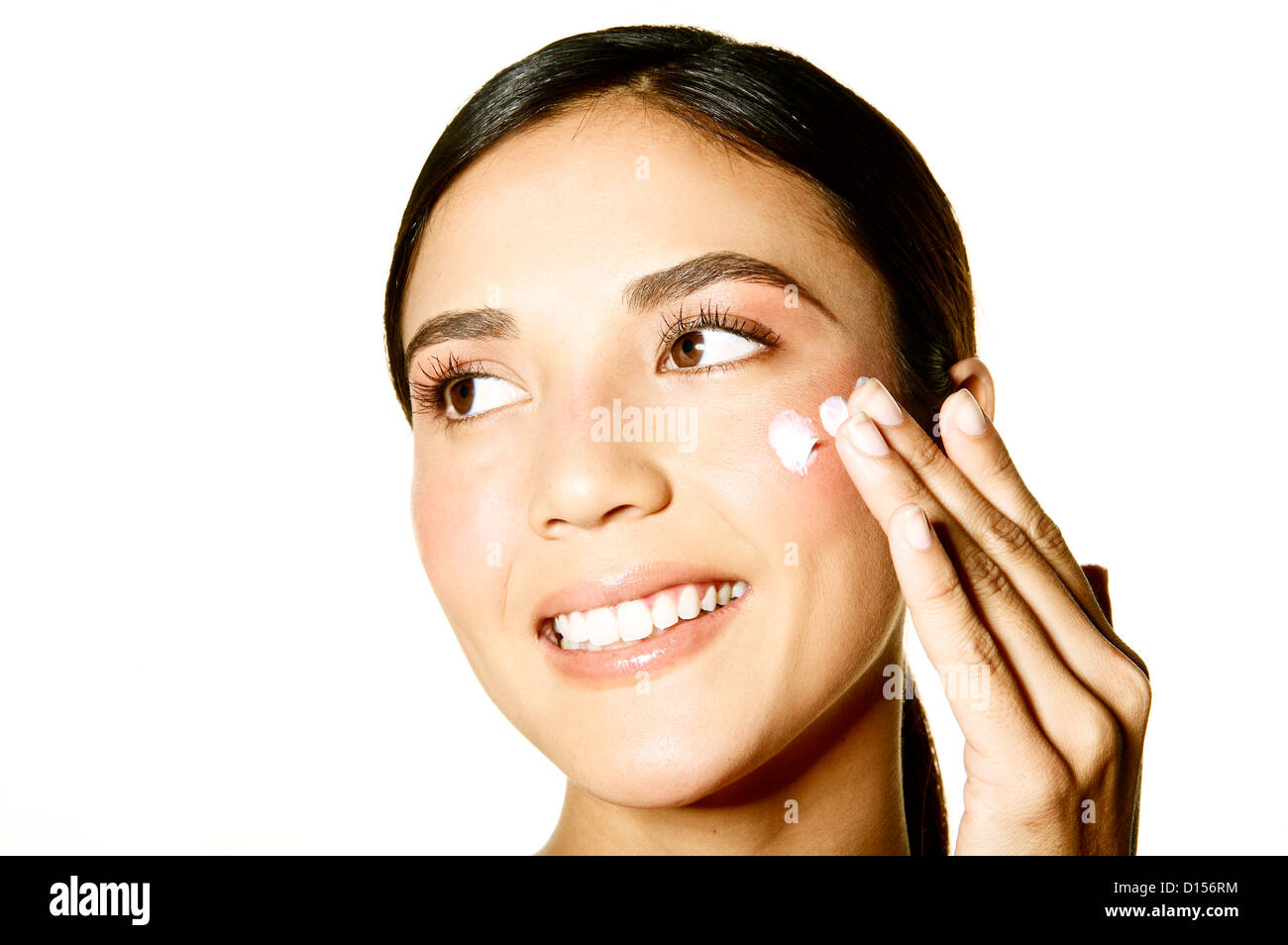 Hawaii, Studio Headshot Of A Beautiful Girl Applying Moisturizer On Her ...