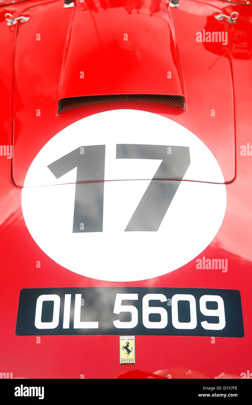 The front of a classic red Ferrari racing car with a number 17 on the ...