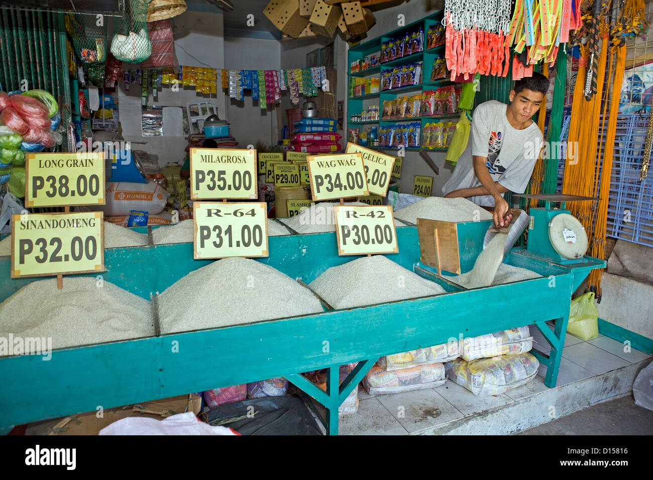 Teenage Filipino Man Selling White Rice Stock Photo - Alamy