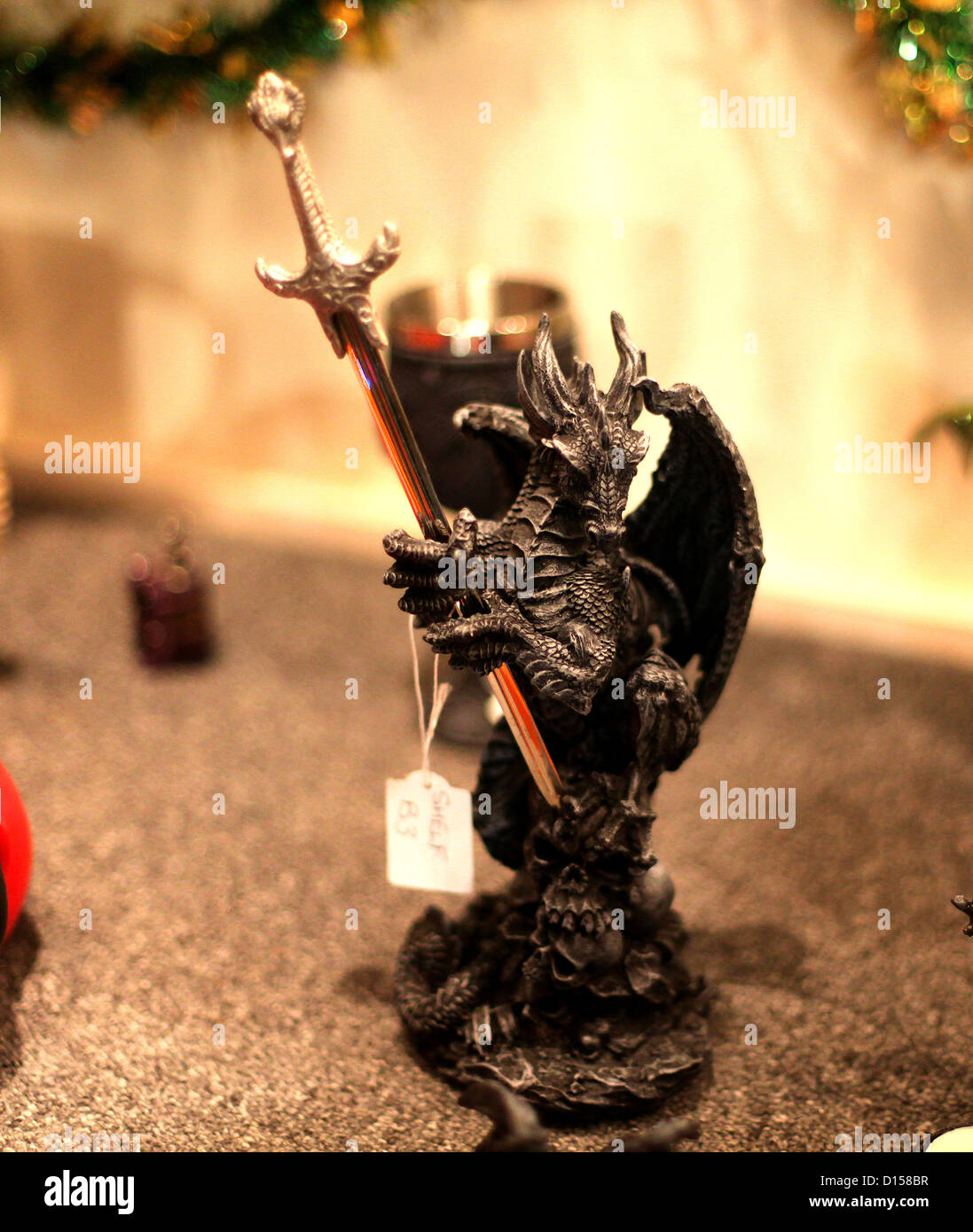 Dragon figures on display in a shop window in Cheddar gorge, December ...