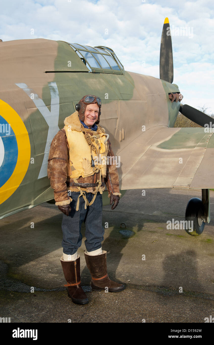 Smiling World War Two RAF pilot standing next to a Hurricane fighter ...