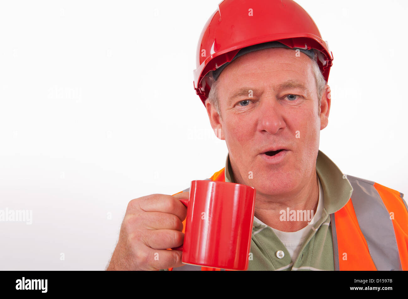 Builder wearing a red hat and drinking tea from a red cup Stock Photo ...