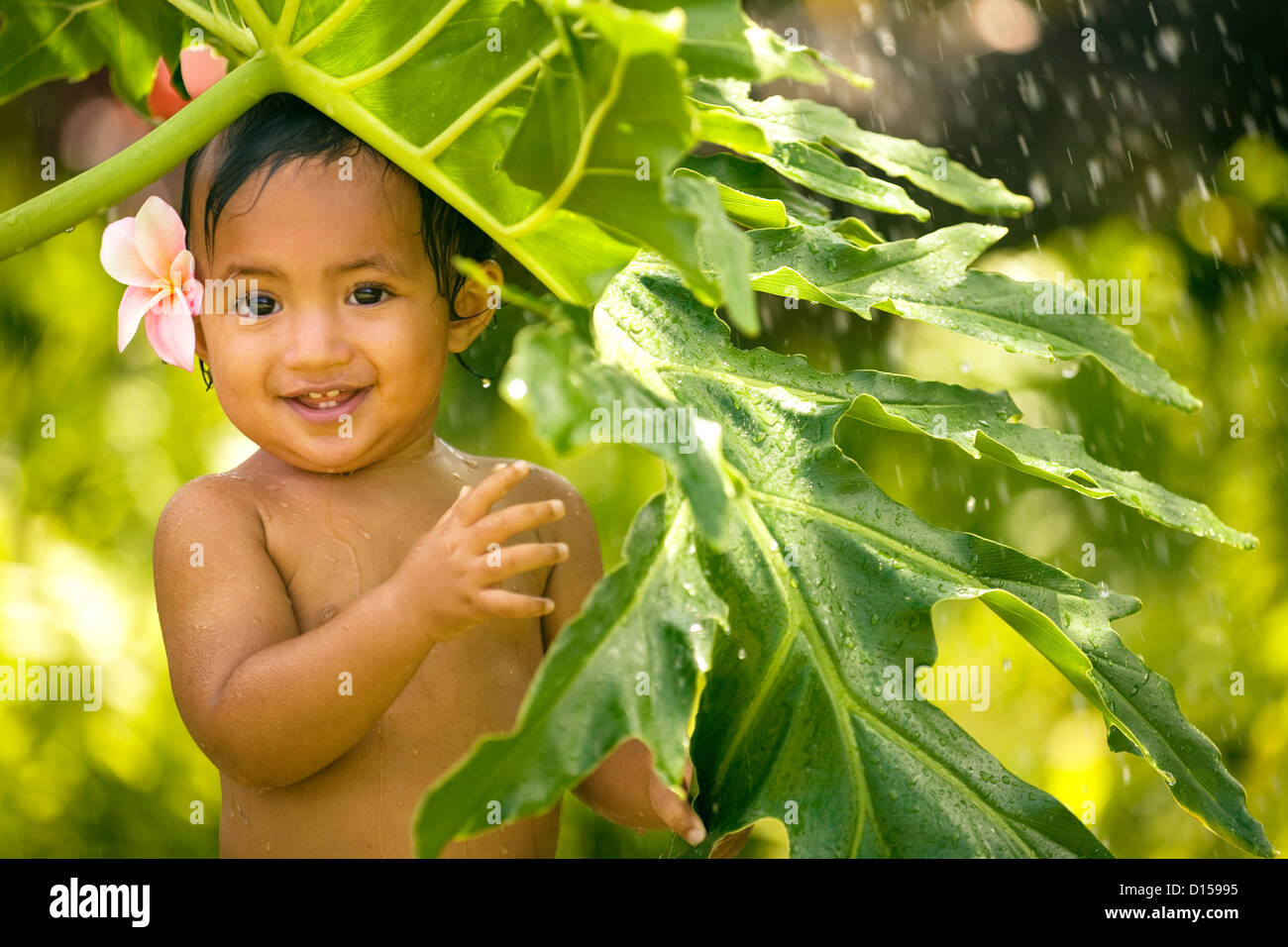 Hawaii, Oahu, Baby Girl Playing With Water Stock Photo - Alamy