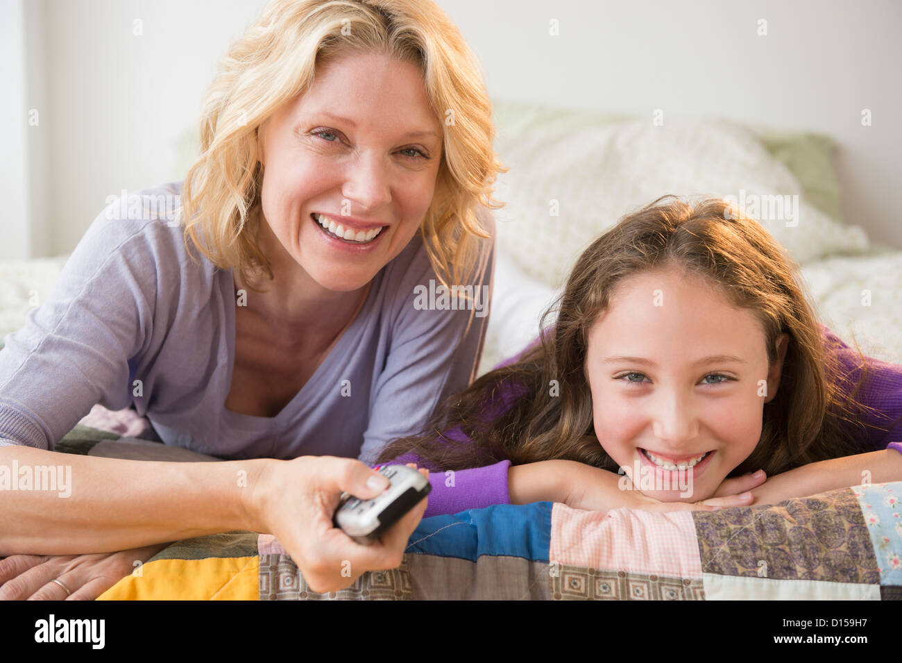 USA, New Jersey, Jersey City, Mother and daughter (8-9) watching TV Stock Photo - Alamy
