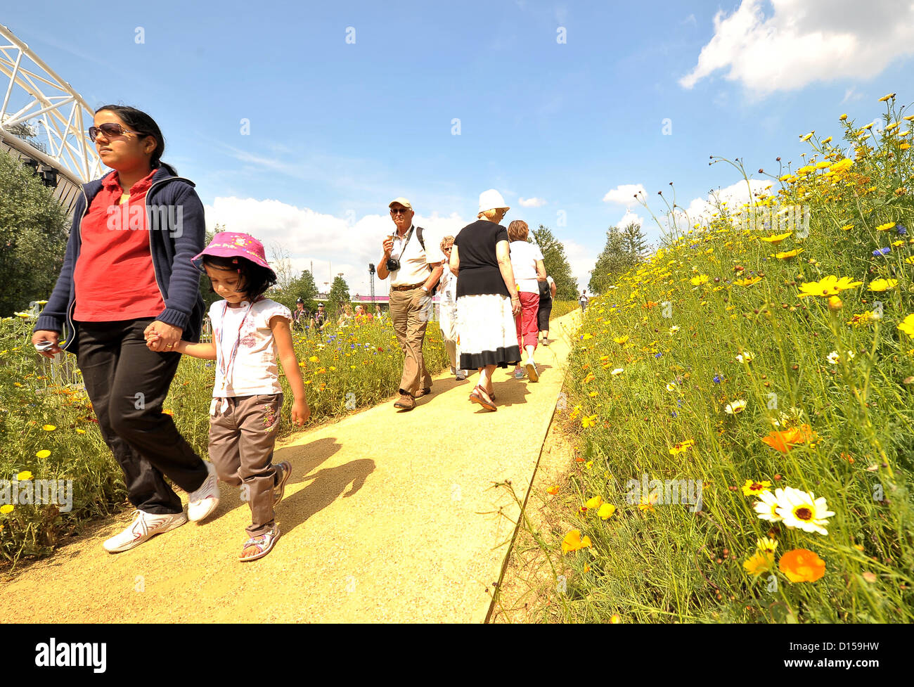 Visitors walk down paths surrounded by flowers Stock Photo - Alamy