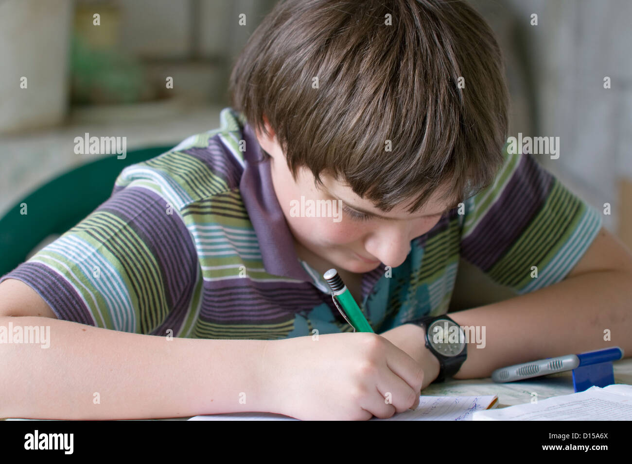 A boy hardly solving homework Stock Photo - Alamy
