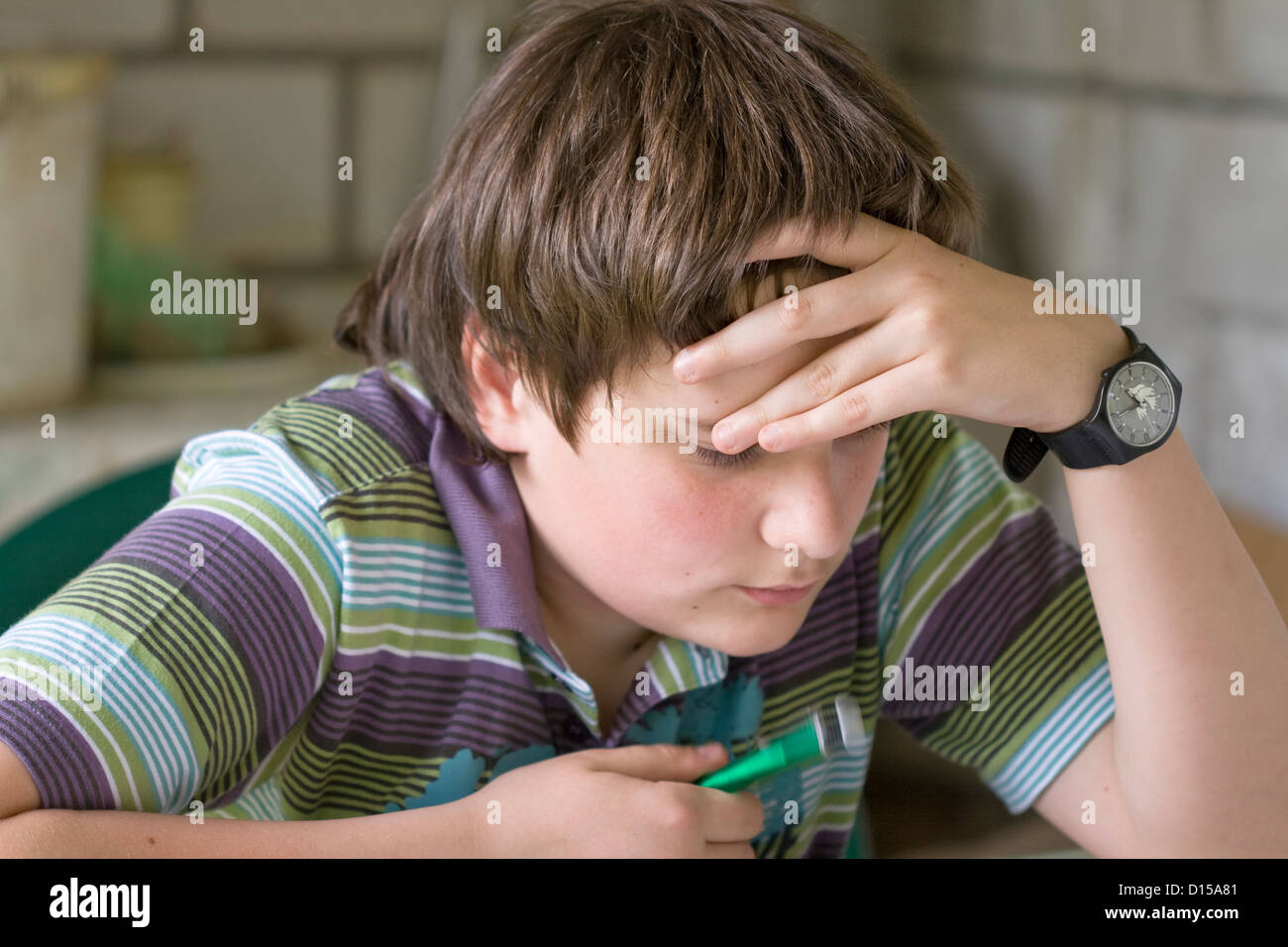 A boy hardly solving homework Stock Photo - Alamy