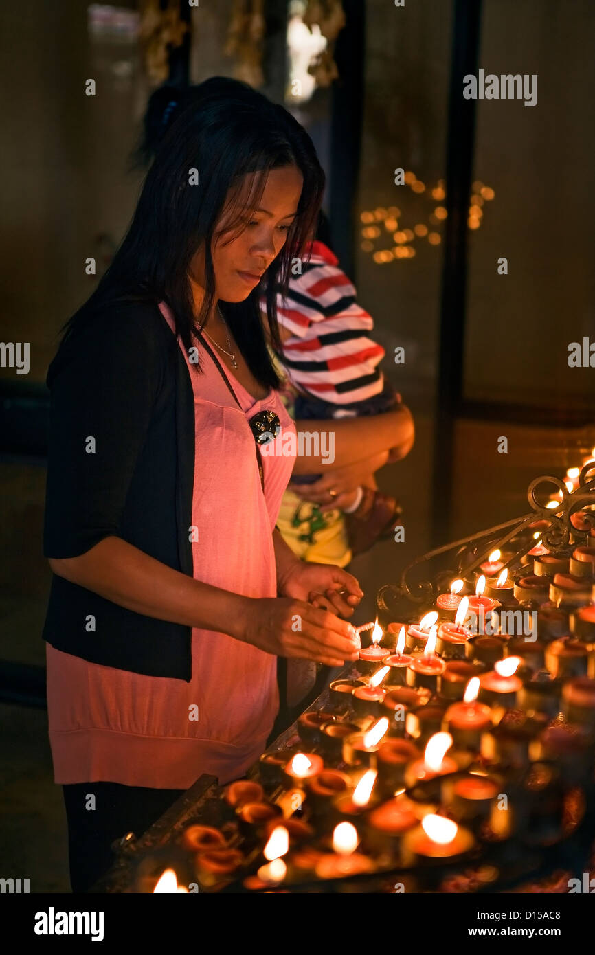 Filipino praying hi-res stock photography and images - Alamy