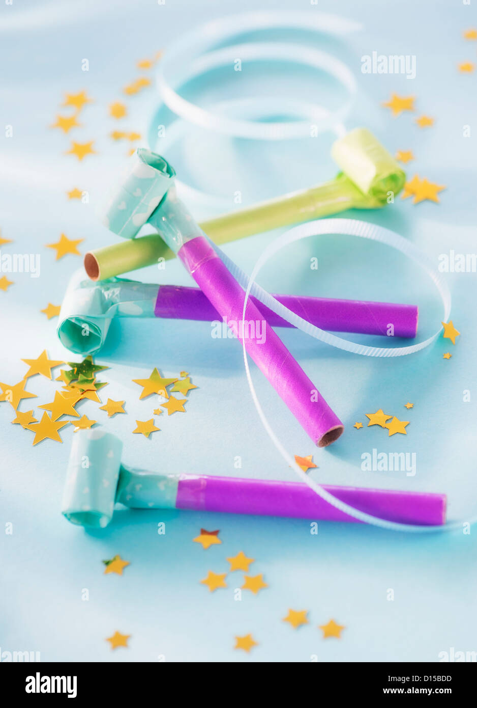 Studio shot of party blowers and confetti Stock Photo - Alamy