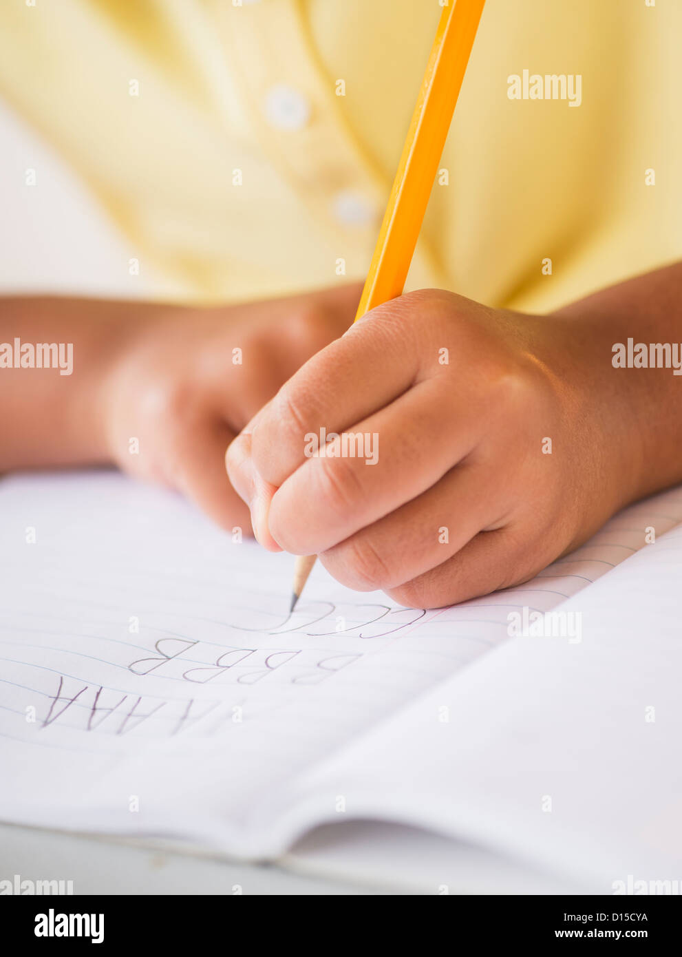 USA, New Jersey, Jersey City, Girl (6-7) doing homework, close-up of ...
