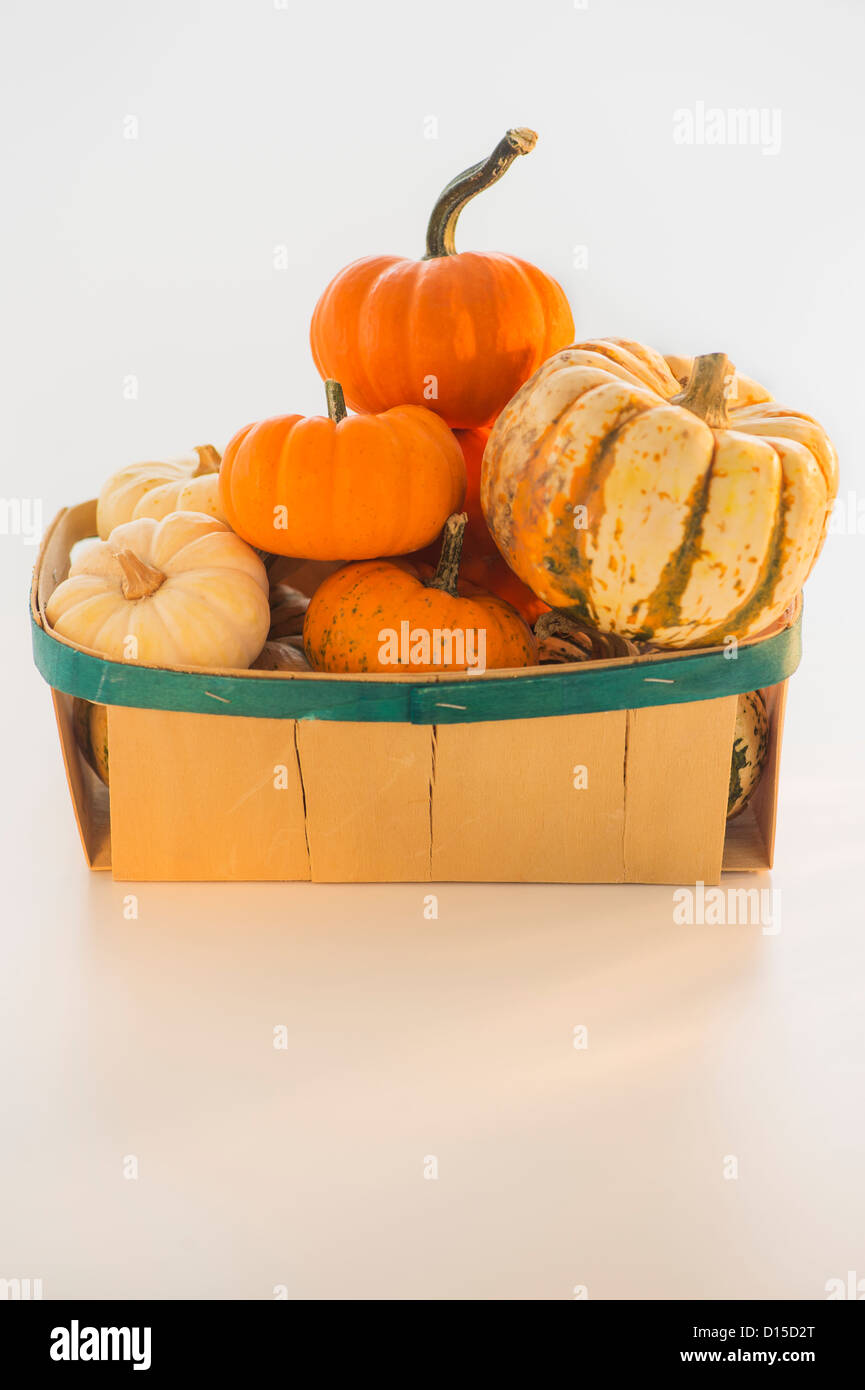 Basket full of pumpkins Stock Photo - Alamy
