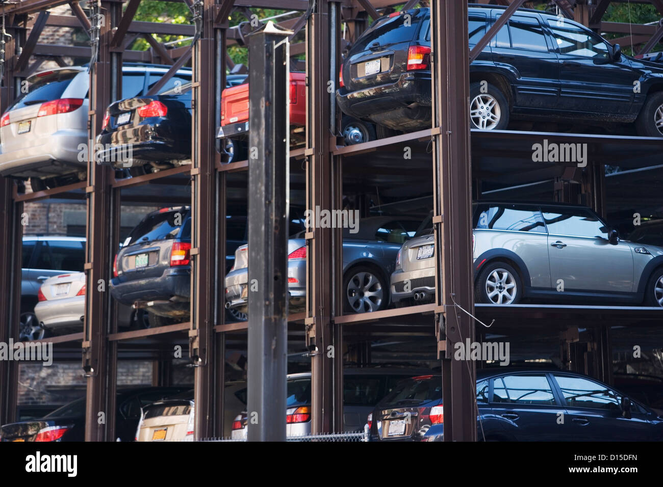Cars in parking lift Stock Photo - Alamy
