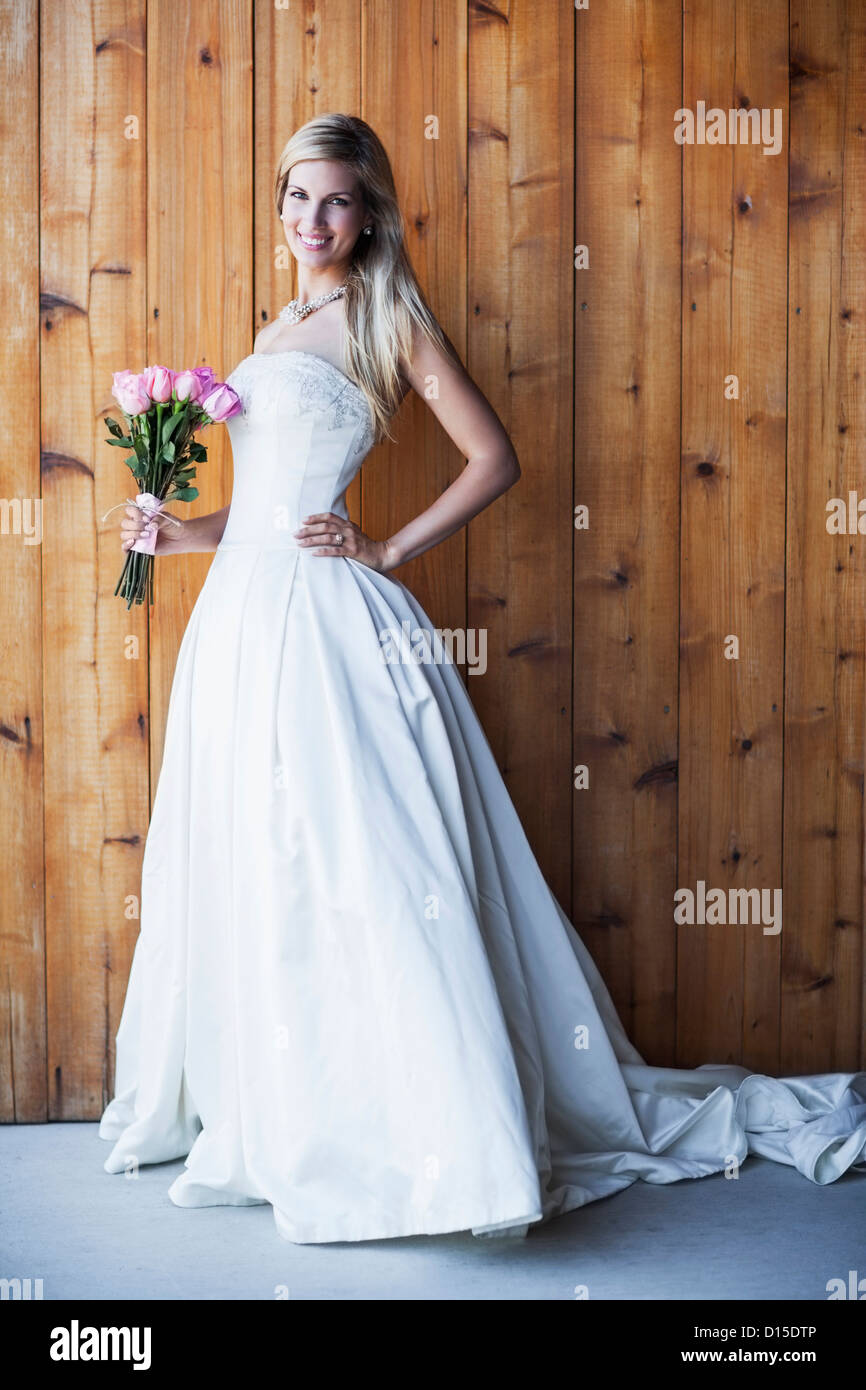 Portrait of bride holding bouquet Stock Photo - Alamy