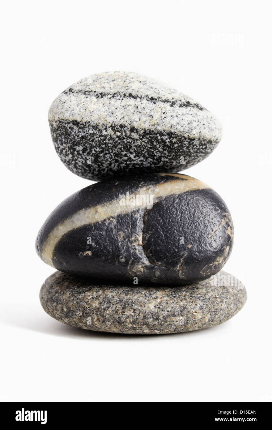 Studio shot of stack of three stones white background Stock Photo - Alamy