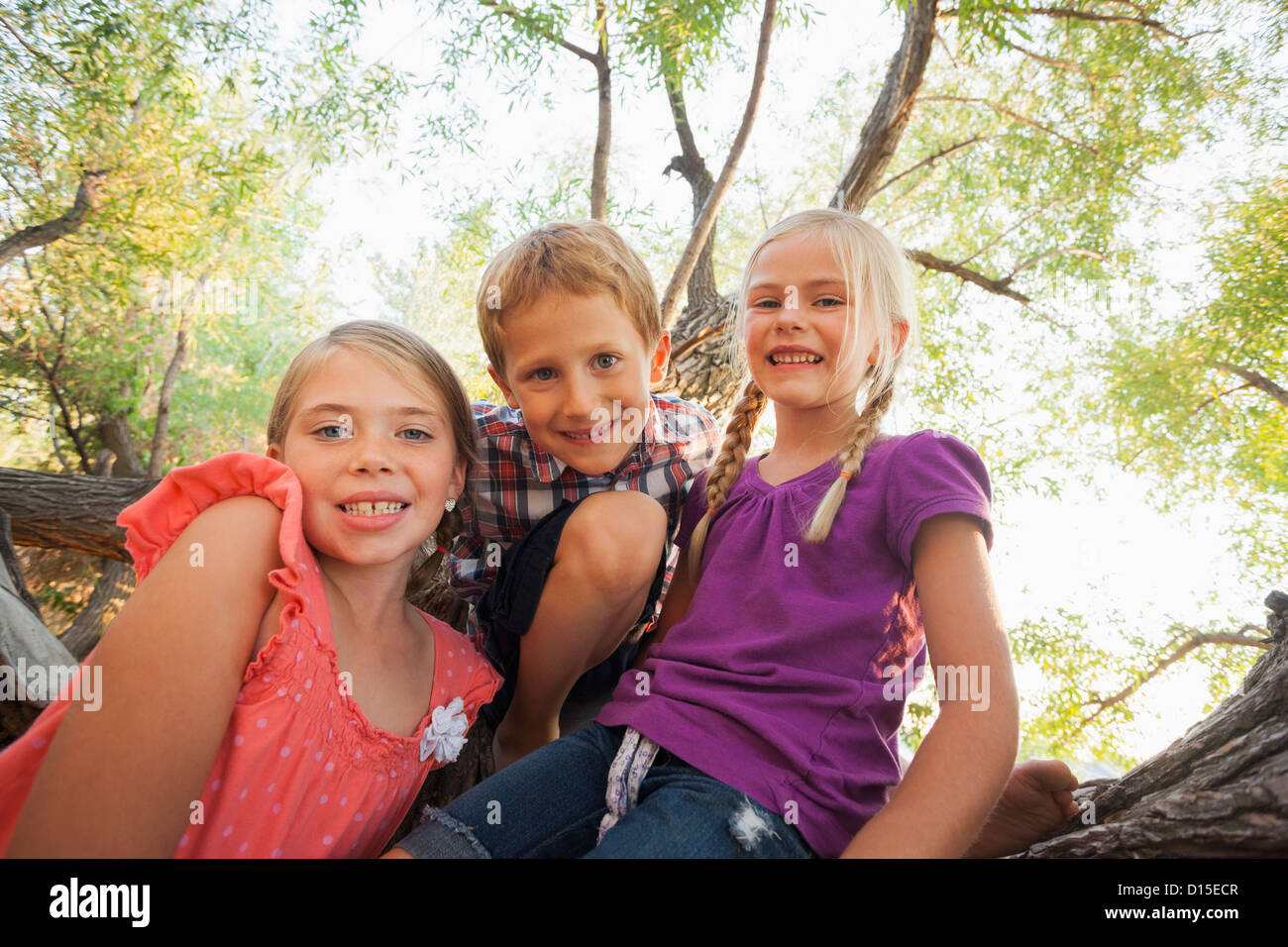 USA, Utah, Lehi, Three children (4-5, 6-7) smiling for portrait in huge ...